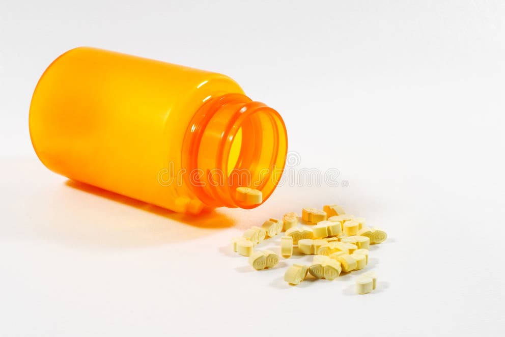 Tiny Yellow Prescription Pills Stock Photo - Image of amber, medical ...