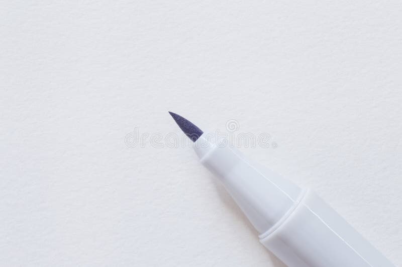 Tip of Blue Marker Laying on Blank Sheet of Sketch Book Stock Photo ...
