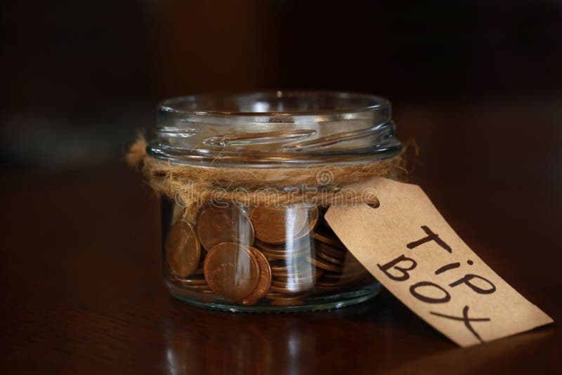 Tip Box Full of Coins on Wooden Table in Cafe, Closeup Stock Image ...
