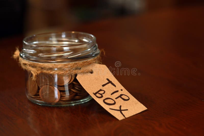 Tip Box Full of Coins on Wooden Table in Cafe, Space for Text Stock ...