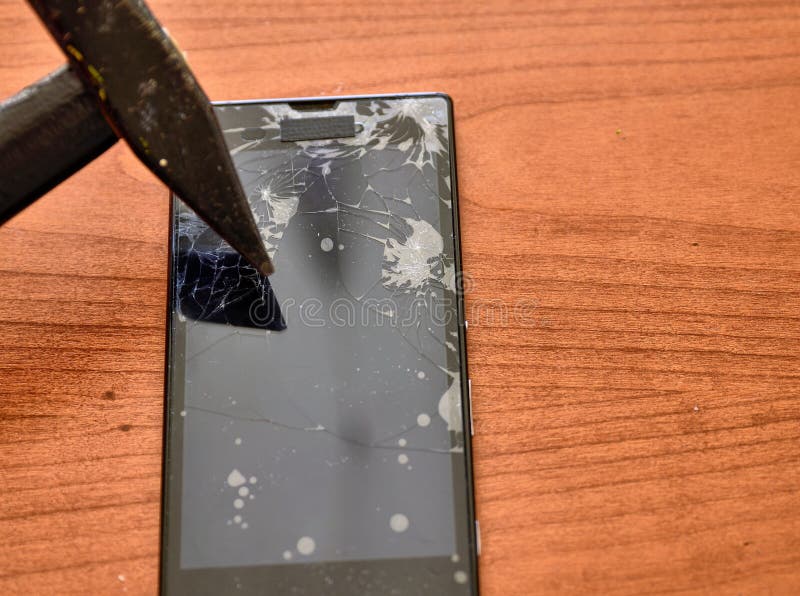 The Tip of the Hammer Hit the Screen of the Smartphone Stock Photo ...