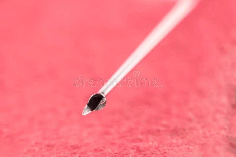 On the Tip of a Needle from a Syringe Drop of Liquid Stock Photo ...