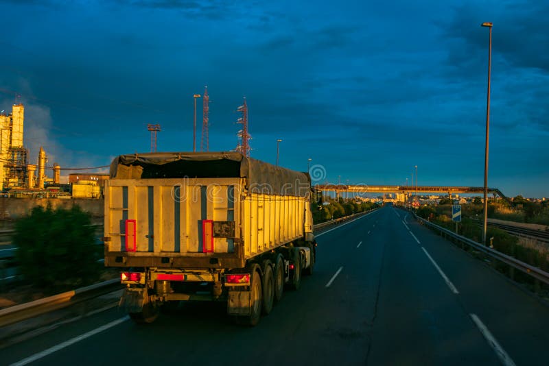 Tipper Truck Driving on a Highway Stock Image - Image of hour, vehicle ...