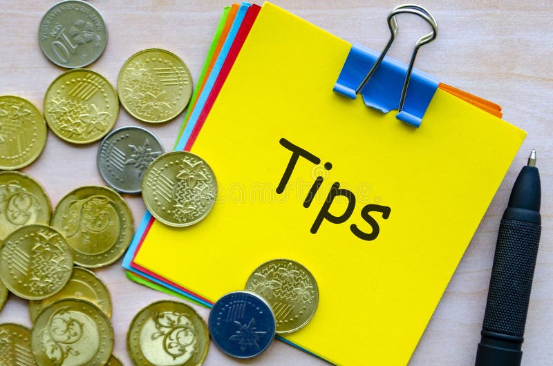 Tips Text on Yellow Paper Covered with White Envelope and Surrounded by ...