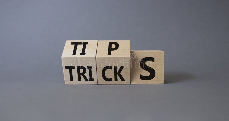 Tips and Tricks Symbol. Wooden Cubes with Words Tricks and Tips. Beautiful Grey Background ...
