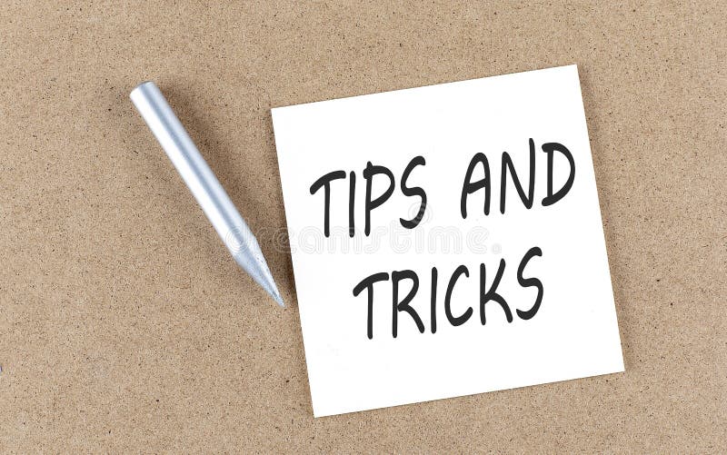 TIPS and TRICKS Text on Sticky Note on a Cork Board with Pencil Stock ...