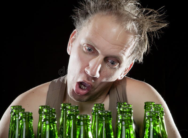 The Tipsy Man Sits with a Heap of Beer Bottles, a Hangover Stock Photo ...