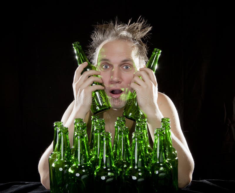 The Tipsy Man Sits with a Heap of Beer Bottles, a Hangover Stock Photo ...