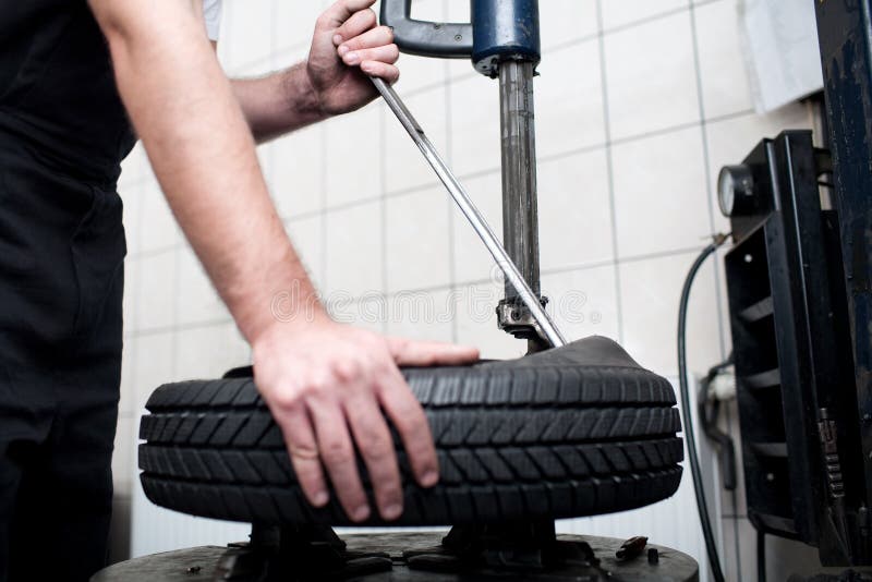 Tire change closeup stock image. Image of caucasian, change - 10690573