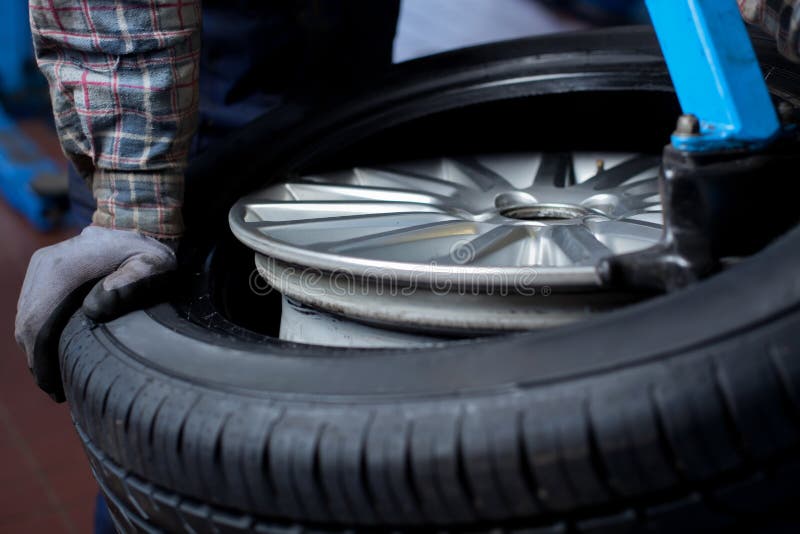 Tire change closeup stock image. Image of tyre, person - 25161833