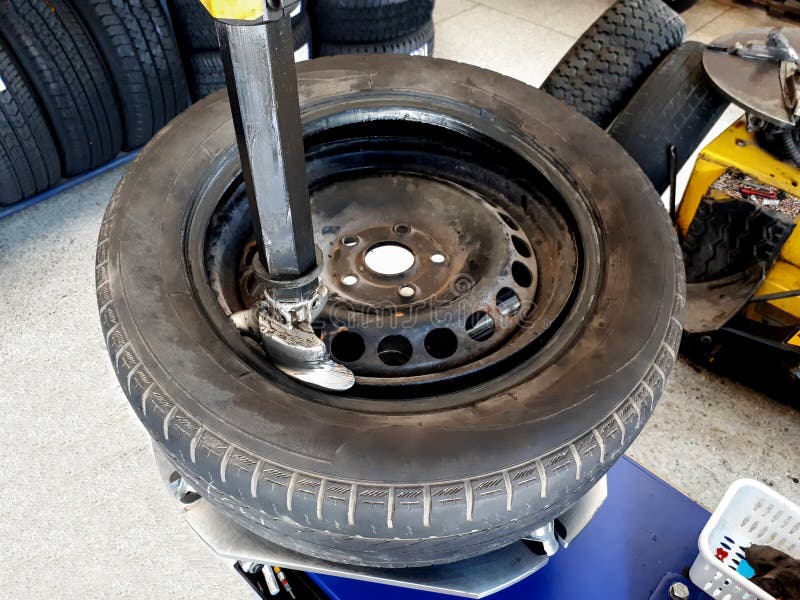 Tire changer machine stock image. Image of male, changing - 94830783