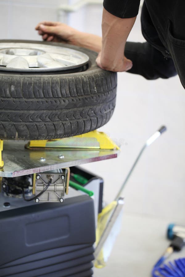 Tire changing stock image. Image of adjust, servicing - 25076571