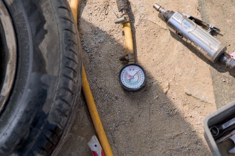 Tire Maintenance Setup on Sandy Ground Stock Photo - Image of detail ...