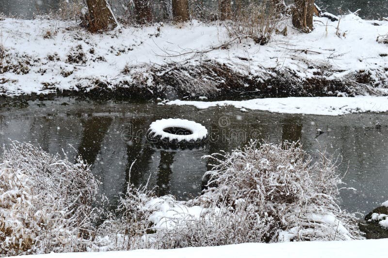 Tire in the river stock photo. Image of color, nature - 137018026