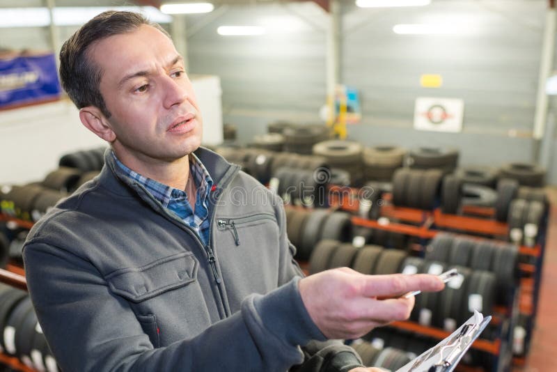 Tire Shop Inventory Personnel Stock Image - Image of expert, check ...