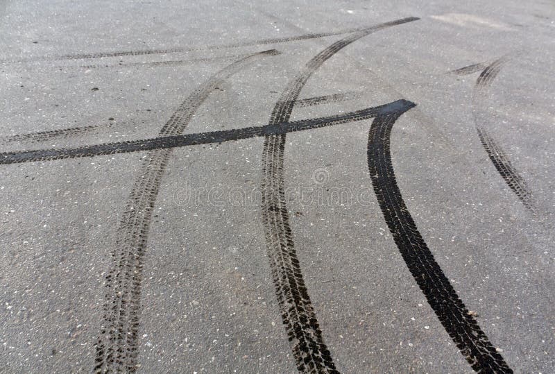 Tire tracks on asphalt. stock image. Image of grungy - 64882199