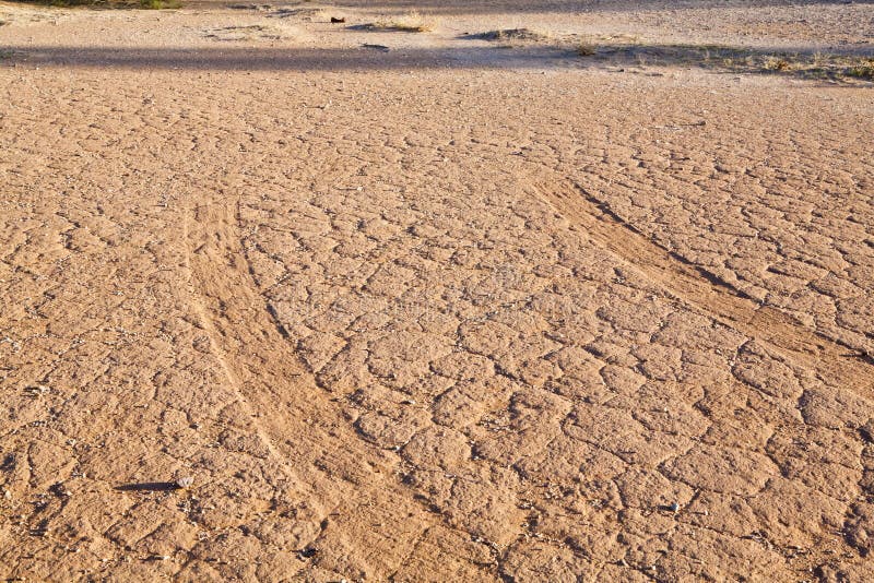 Tire tracks on dried mud stock photo. Image of vista - 58869842
