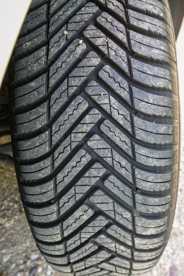 A Tire with a Tread Pattern Stock Photo - Image of track, tire: 380006870
