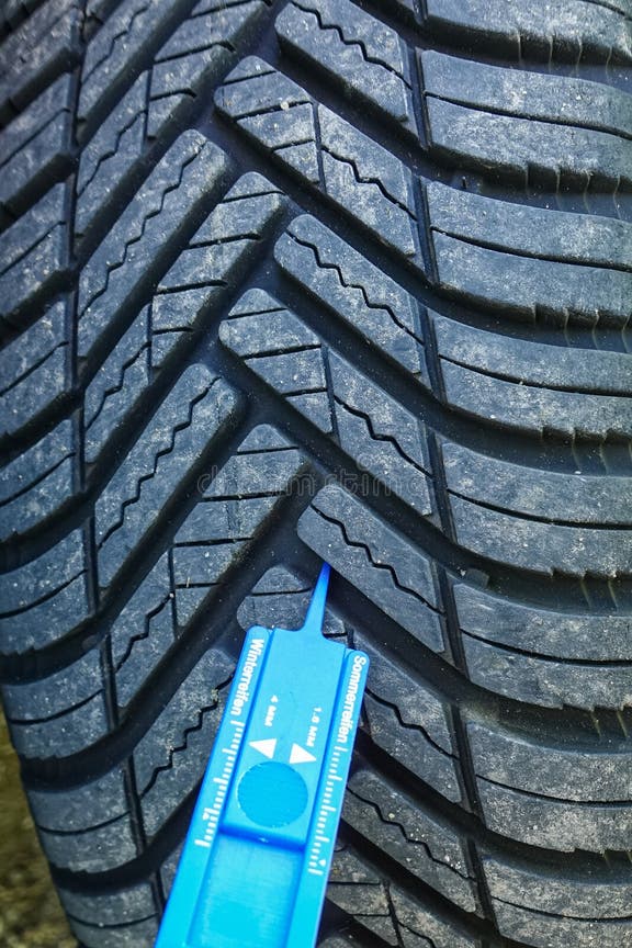 A Tire with a Tread Pattern Stock Image - Image of ruler, tyre: 380006909