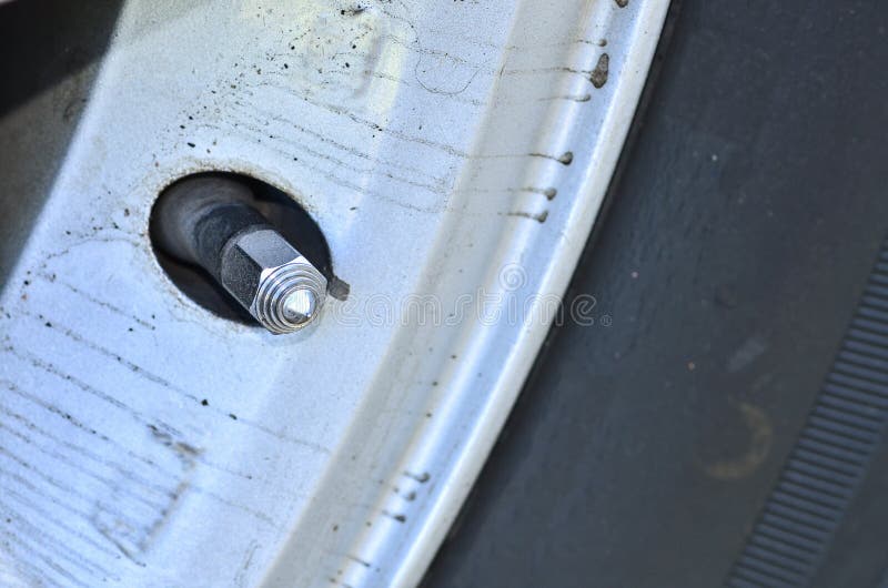 Tire valve on car wheel stock photo. Image of close, silver - 67524278