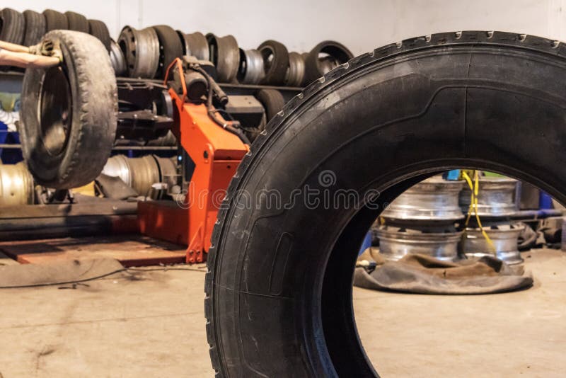 Tire workshop operator stock image. Image of workshop - 213905063