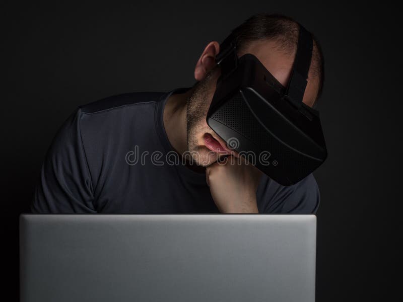 Tired Addicted Man To Technology Using Virtual Reality Headset Stock ...