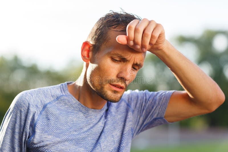 Tired Athlete Wiping with Hand Sweat from Forehead Closeup Stock Photo ...