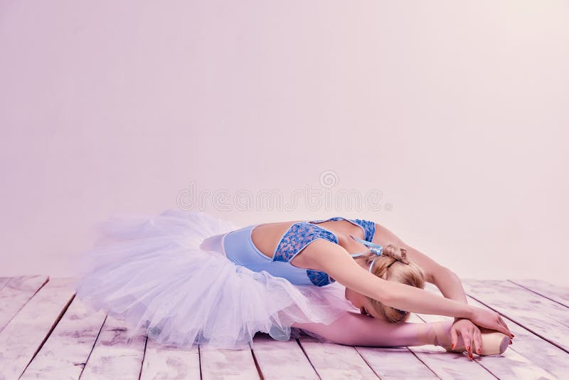 Tired Ballet Dancer Lying on the Wooden Floor Stock Image - Image of ...