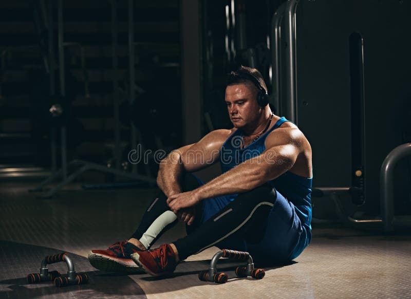 Tired bodybuilder resting stock image. Image of muscular - 88086911