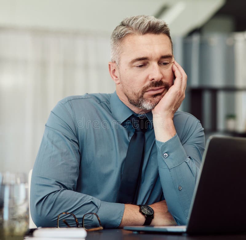 Man Tired And Bored In Office With Computer For Coding Programming And Software Development At