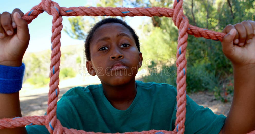 Tired Boy Leaning on Net during Obstacle Course in Boot Camp Stock ...