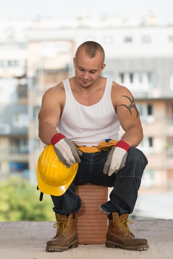 Tired Builder Resting on Brick Stock Photo - Image of brake ...
