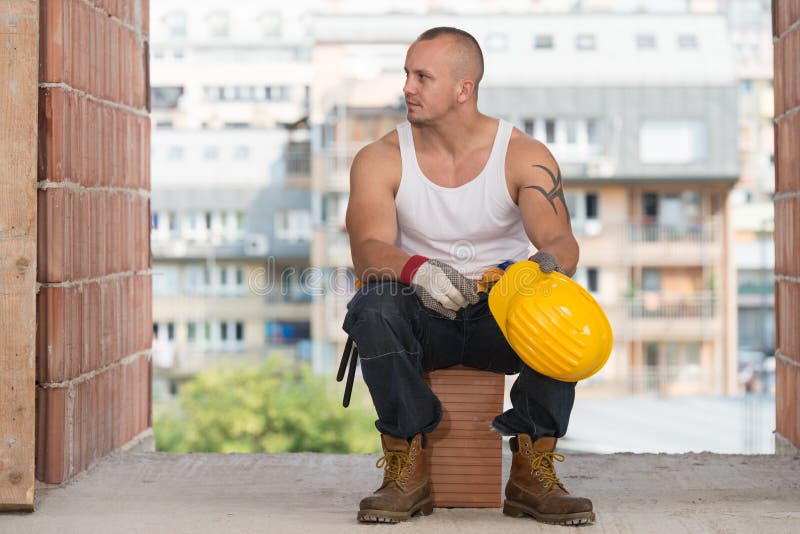 Tired Builder Resting on Brick Stock Image - Image of person ...