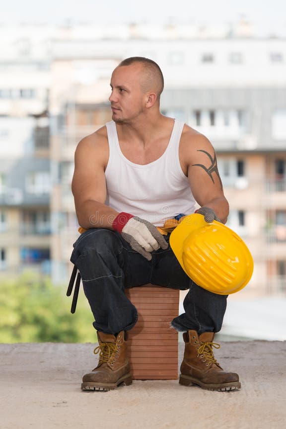 Tired Builder Resting on Brick Stock Photo - Image of relaxation ...