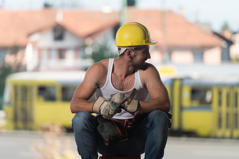 Tired Builder Resting on Brick Stock Image - Image of portrait ...