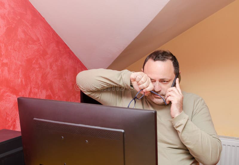 Man Showing Tiredness by a Computer Stock Photo - Image of desktop ...