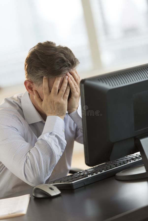 Tired Businessman Leaning on Computer Desk Stock Photo - Image of ...