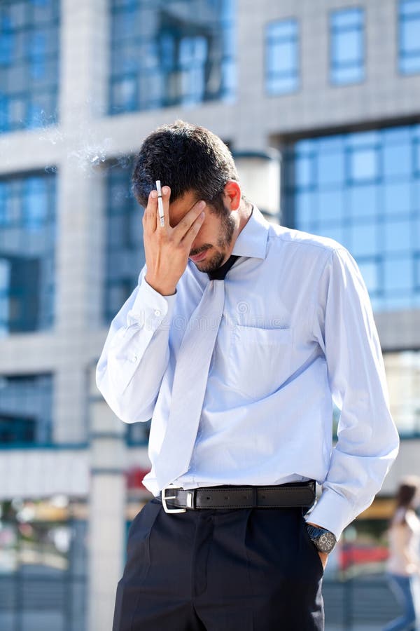 Tired businessman smoking stock image. Image of desperate - 26726187