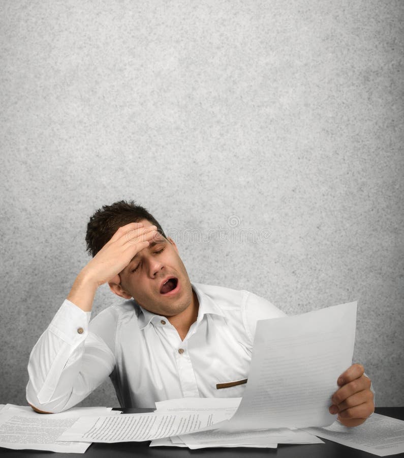 Tired businessman working stock image. Image of table - 29319353
