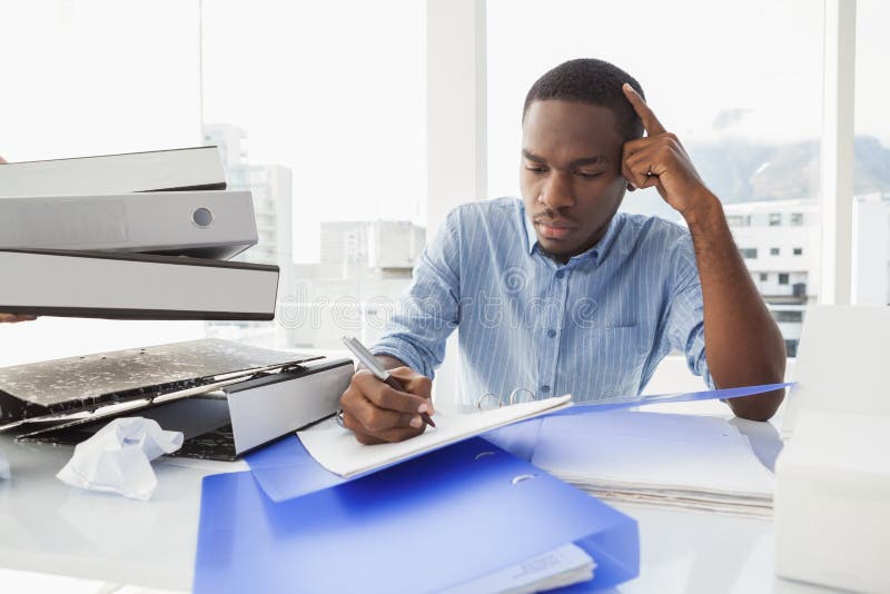 Tired Businessman Writing Notes at Desk Stock Photo - Image of ...