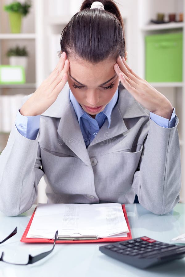 Tired Businesswoman Having a Headache while Working on Paperwork Stock ...