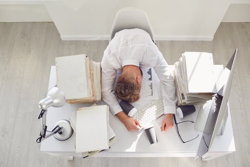 Tired Busy Businessman Sleeping at a Table with a Computer. Stock Image ...