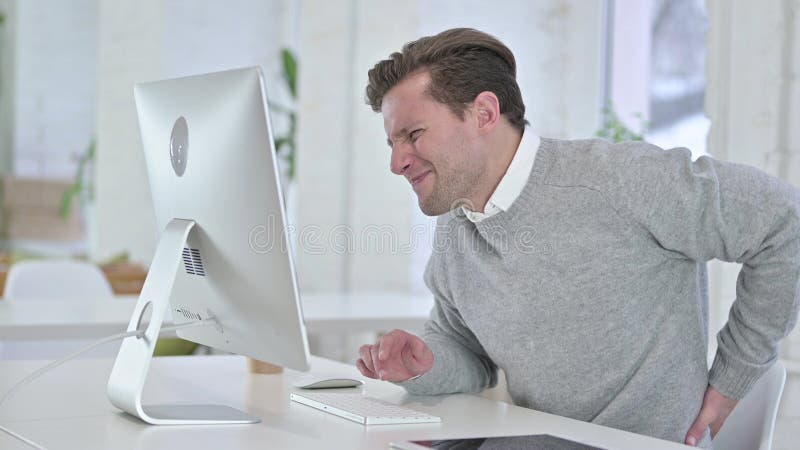Tired Creative Young Man Having Back Pain Stock Photo - Image of spine ...