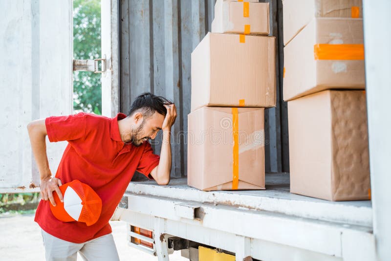 Tired Delivery Man Having Headache while Working with Cardboard Boxes ...