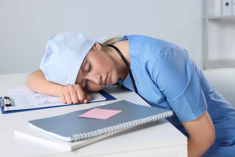 Tired Young Doctor Sleeping at Workplace in Office Stock Image - Image ...