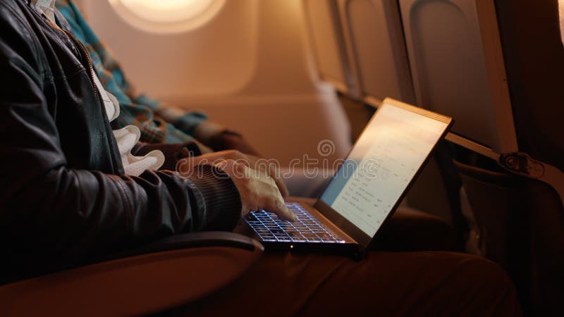 Tired Employee Travelling by Airplane and Working on Laptop Stock Image ...