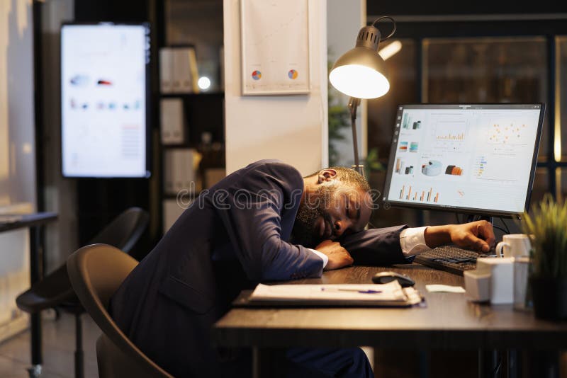 Tired Executive Worker Sleeping on Desk in Startup Office Stock Photo ...