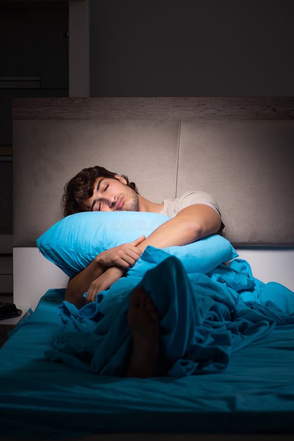 The Tired Exhausted Man Sleeping in His Bed Stock Photo - Image of ...