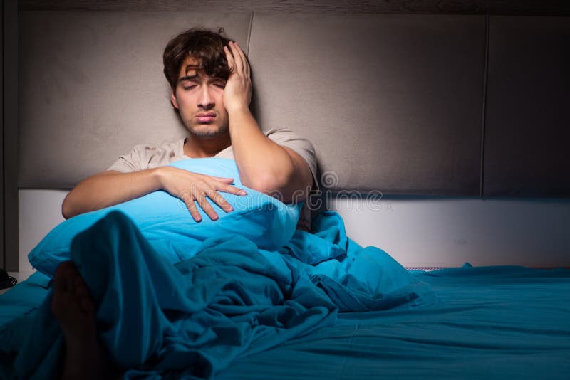 The Tired Exhausted Man Sleeping in His Bed Stock Photo - Image of ...