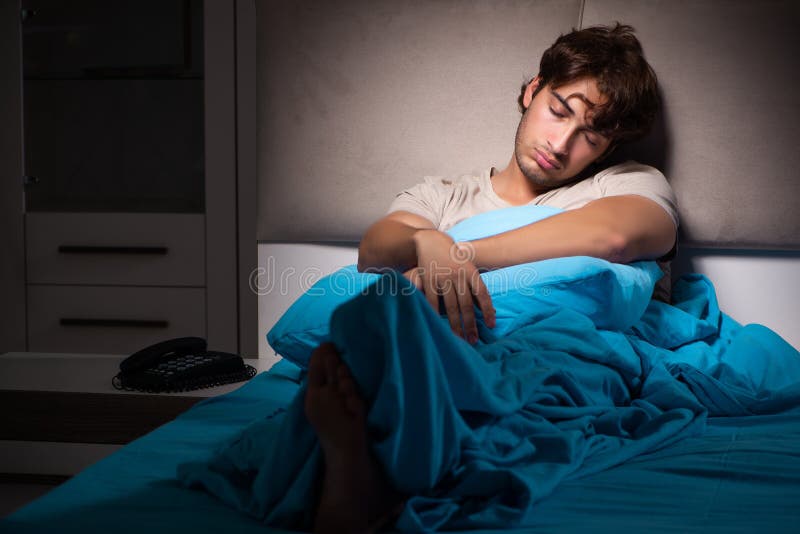 The Tired Exhausted Man Sleeping in His Bed Stock Image - Image of ...